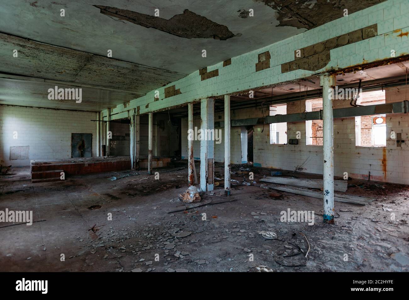 Old empty ruined abandoned industrial building interior Stock Photo - Alamy