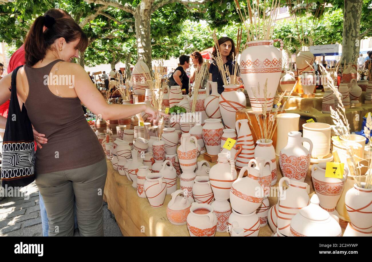 Vases and clay pots on a stall of a ceramic fair in the city of Zamora ...