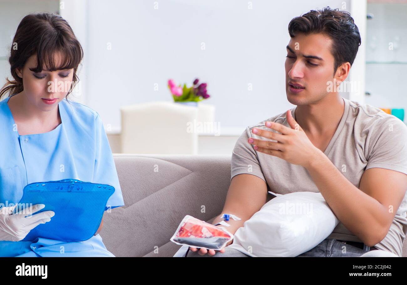 Patient getting blood transfusion in hospital clinic Stock Photo - Alamy
