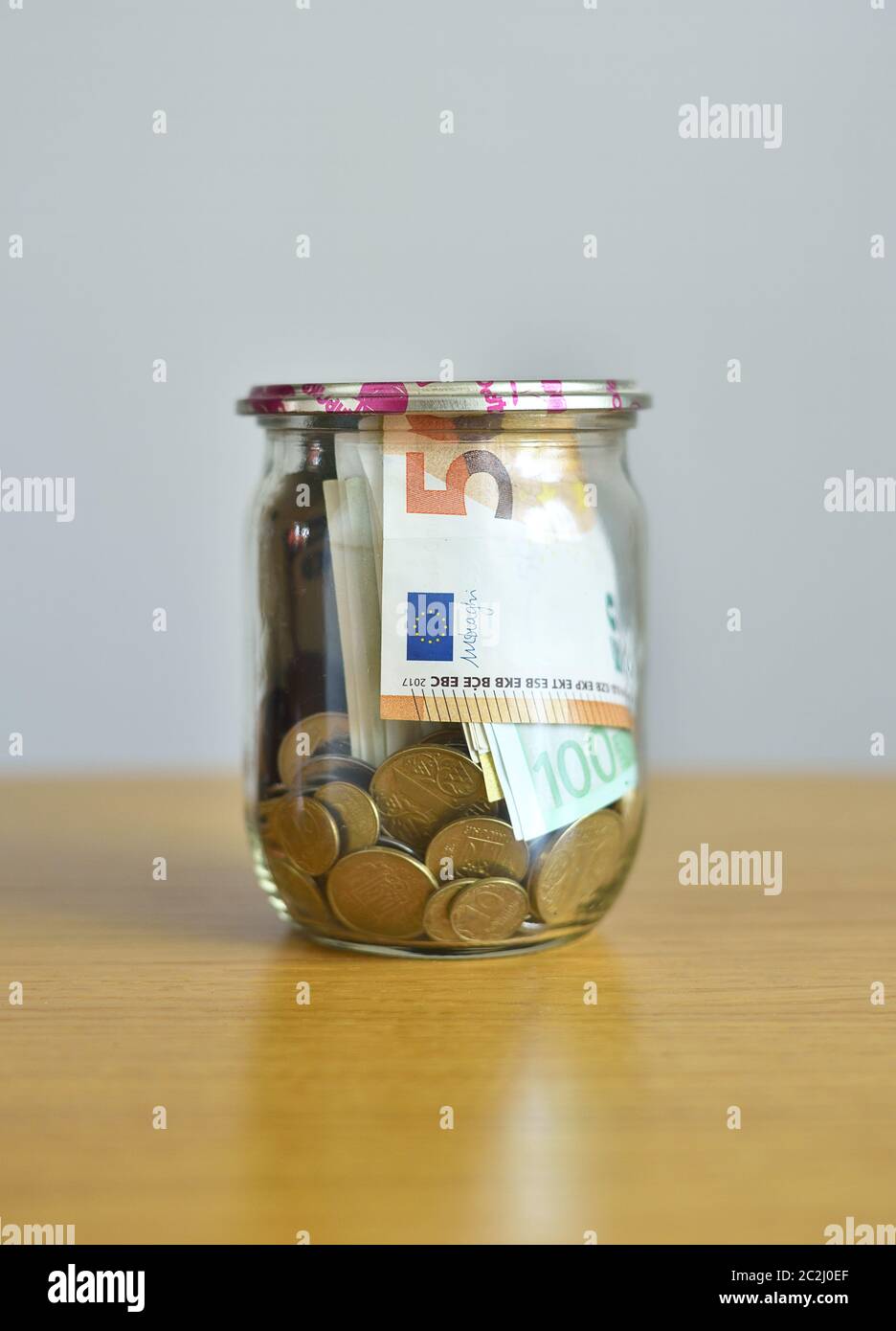 Money in glass hi-res stock photography and images - Alamy