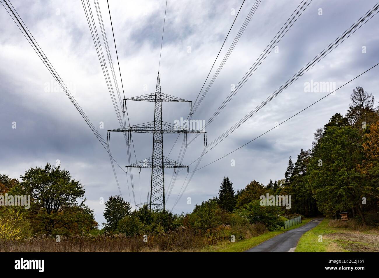 An electric power line in a field Stock Photo - Alamy