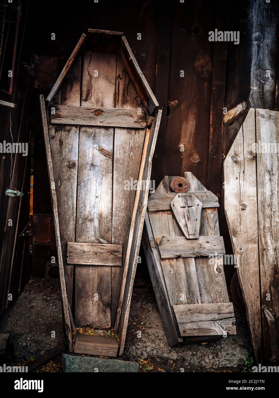 Old wooden coffins for adult and child leaning up in a shed Stock Photo ...