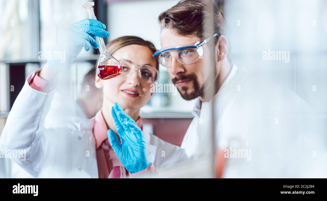 Two happy chemical scientists during breakthrough experiment Stock ...