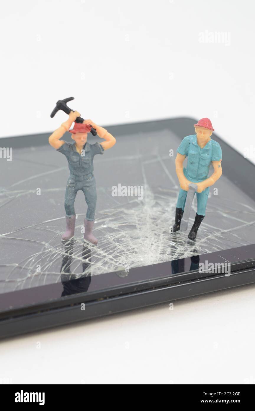 Tech support team are on the task of the broken touch screen device in ...