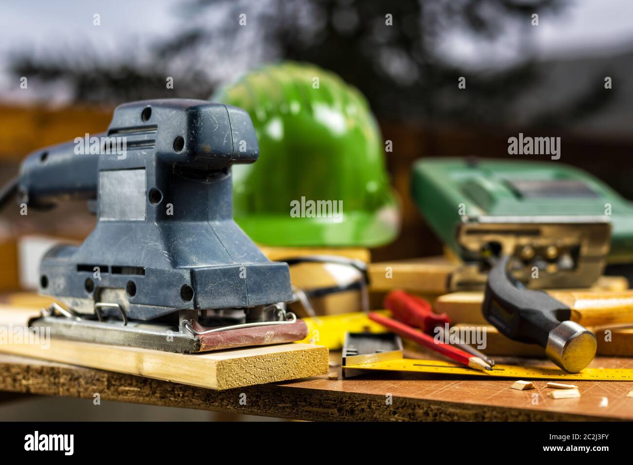 Electric sander for carpenter, carpentry tools on a work table ...