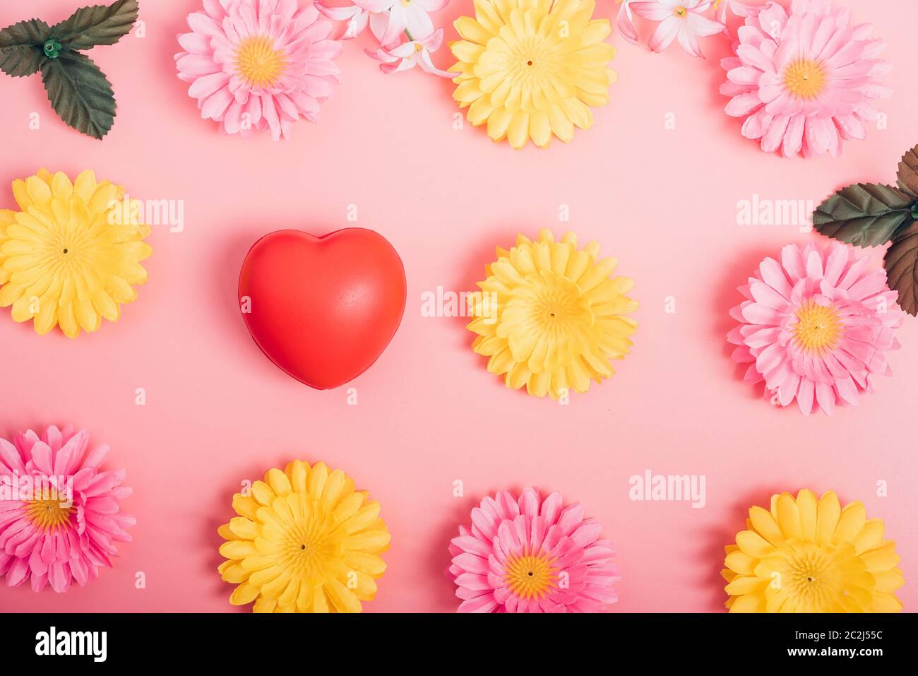 Red heart and flower on pink background with copy space, valentine day ...