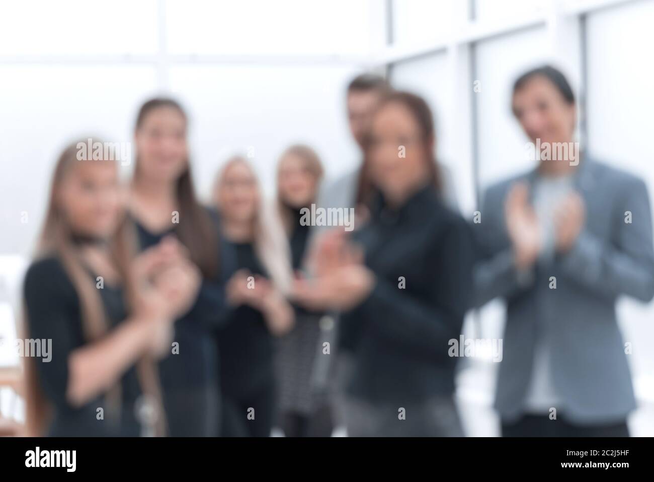 close up. group of happy employees applauding together Stock Photo - Alamy