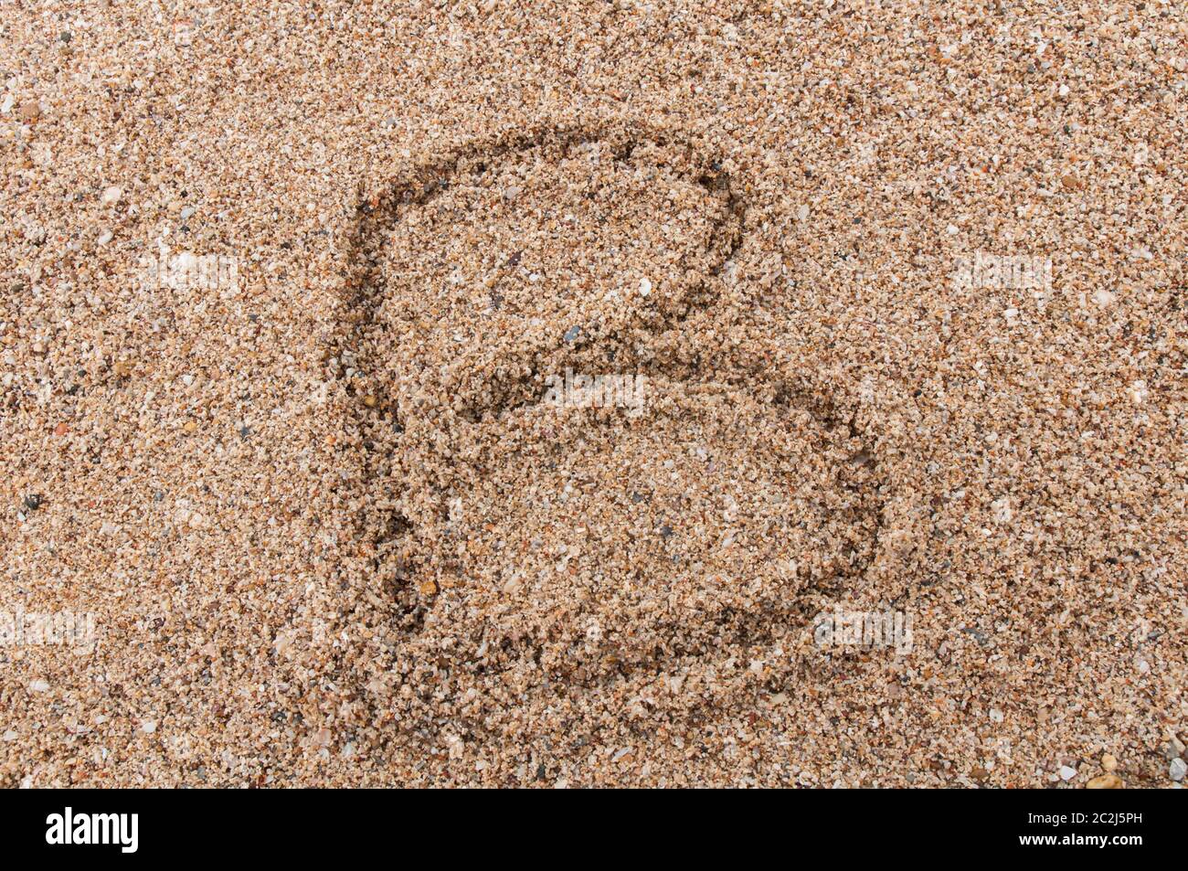 Character B of the alphabet writing on the sand Stock Photo - Alamy
