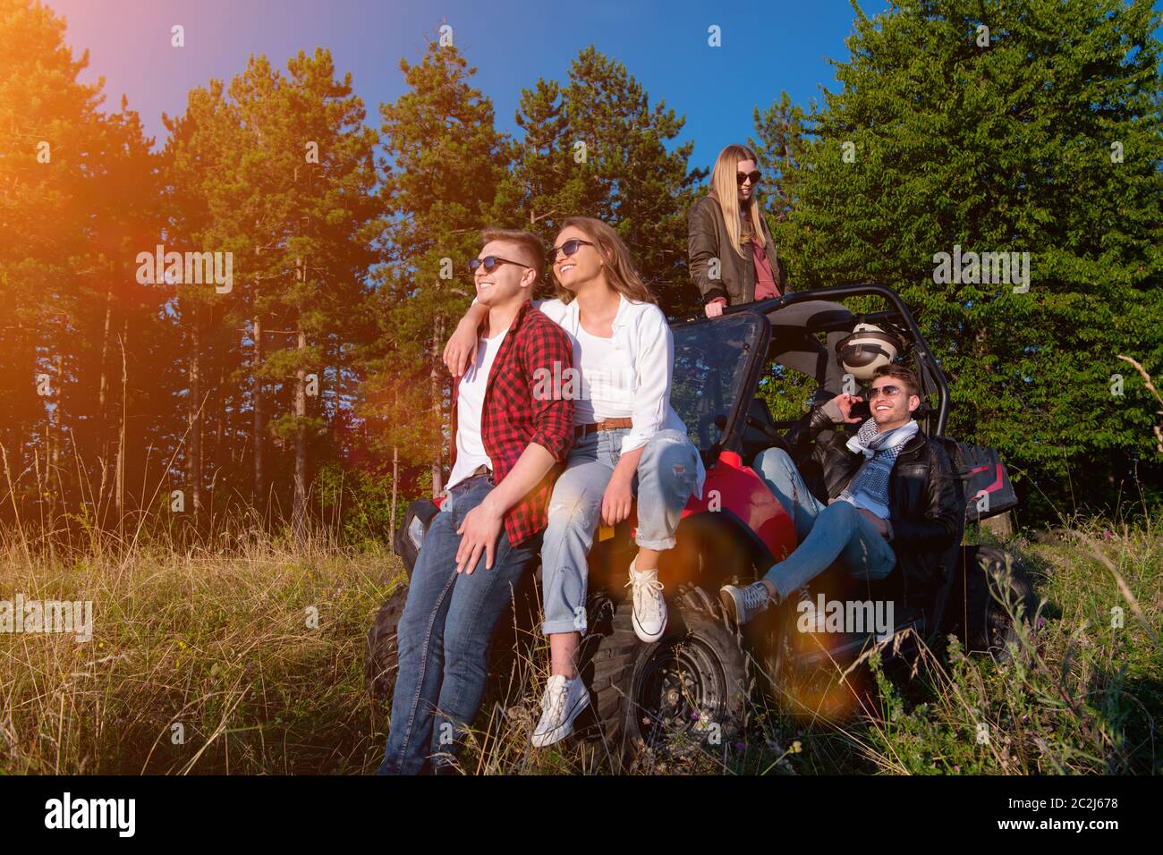 group of young people driving a off road buggy car Stock Photo - Alamy