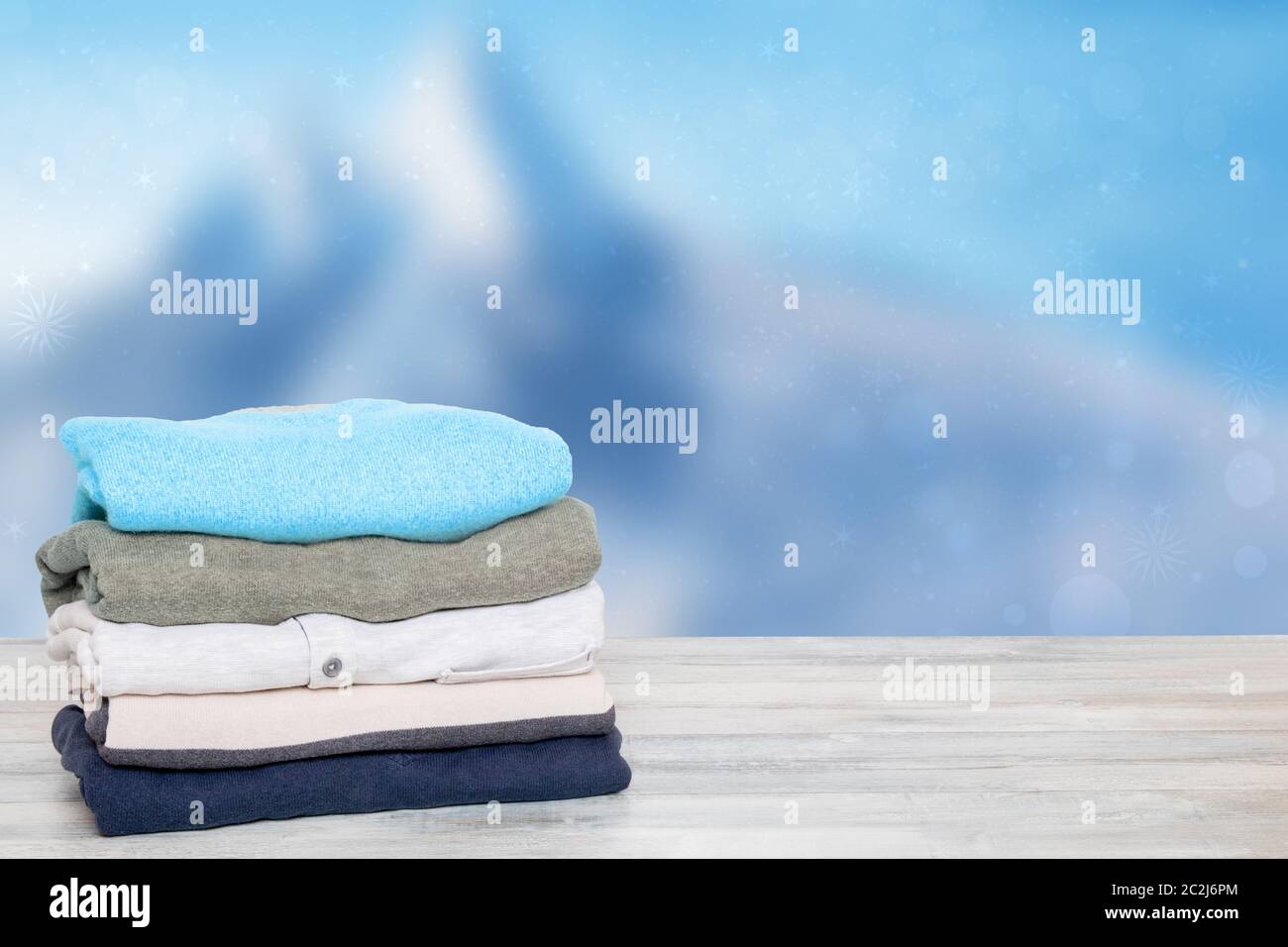 Stack of winter clothes. Pile of colorful knitted cozy warm cashmere ...