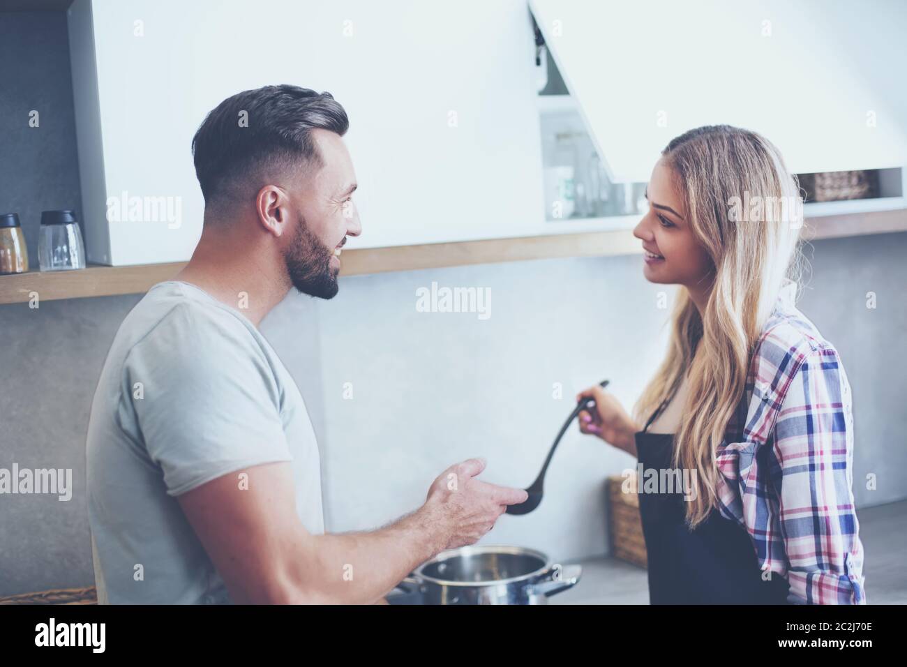 young man is preparing dinner for his family Stock Photo - Alamy
