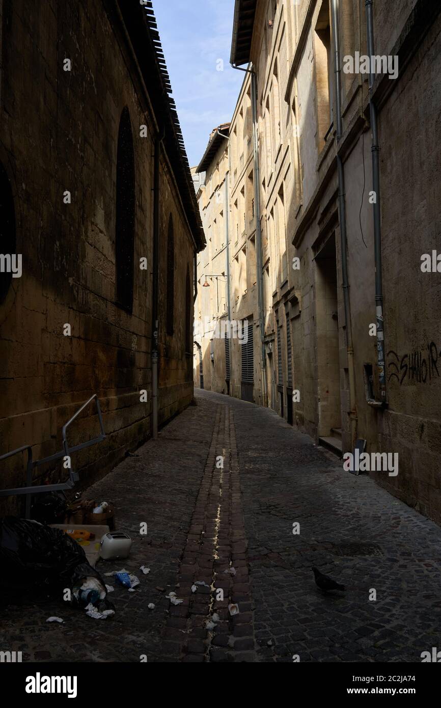 Narrow old gothic quarter streets littered with rubbish (garbage ...