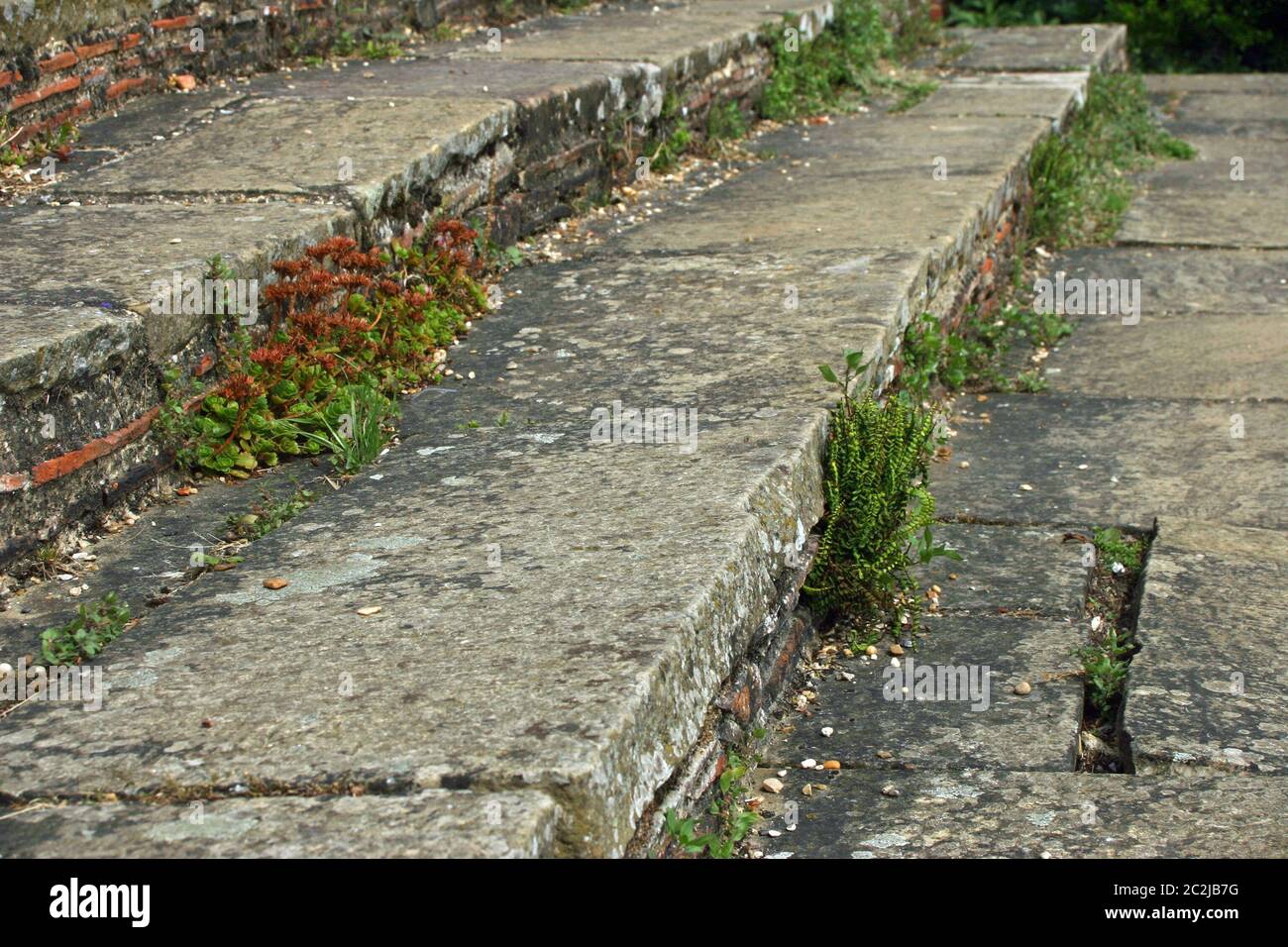 Old stone steps with clay tiles set into the risers. With cracks ...
