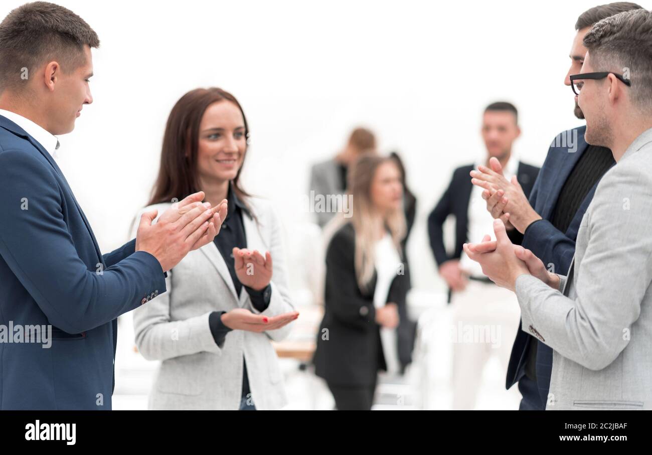 group of employees standing in the office applauding Stock Photo - Alamy