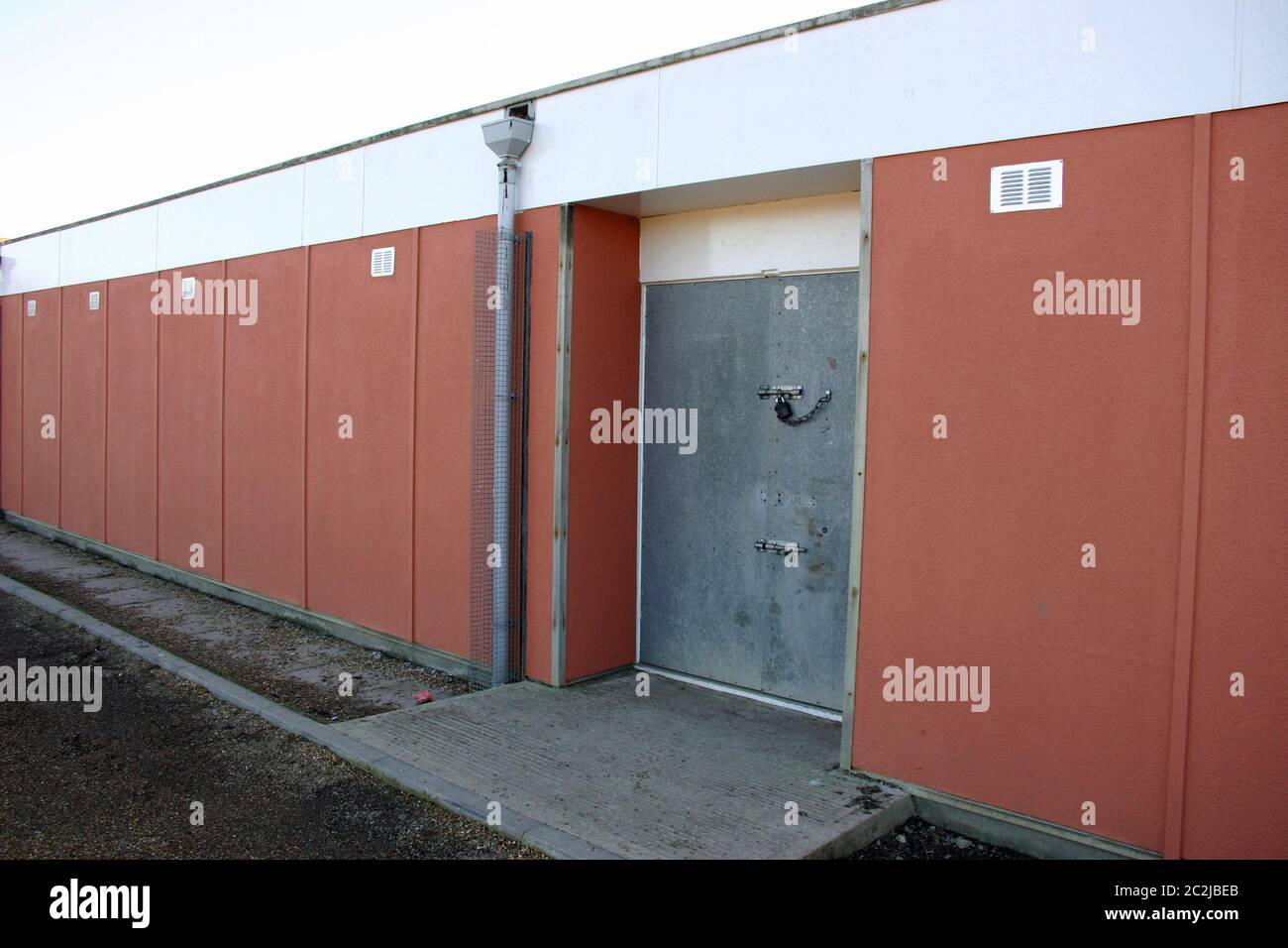 Secure double metal sports pavilion door with padlock and chain and ...