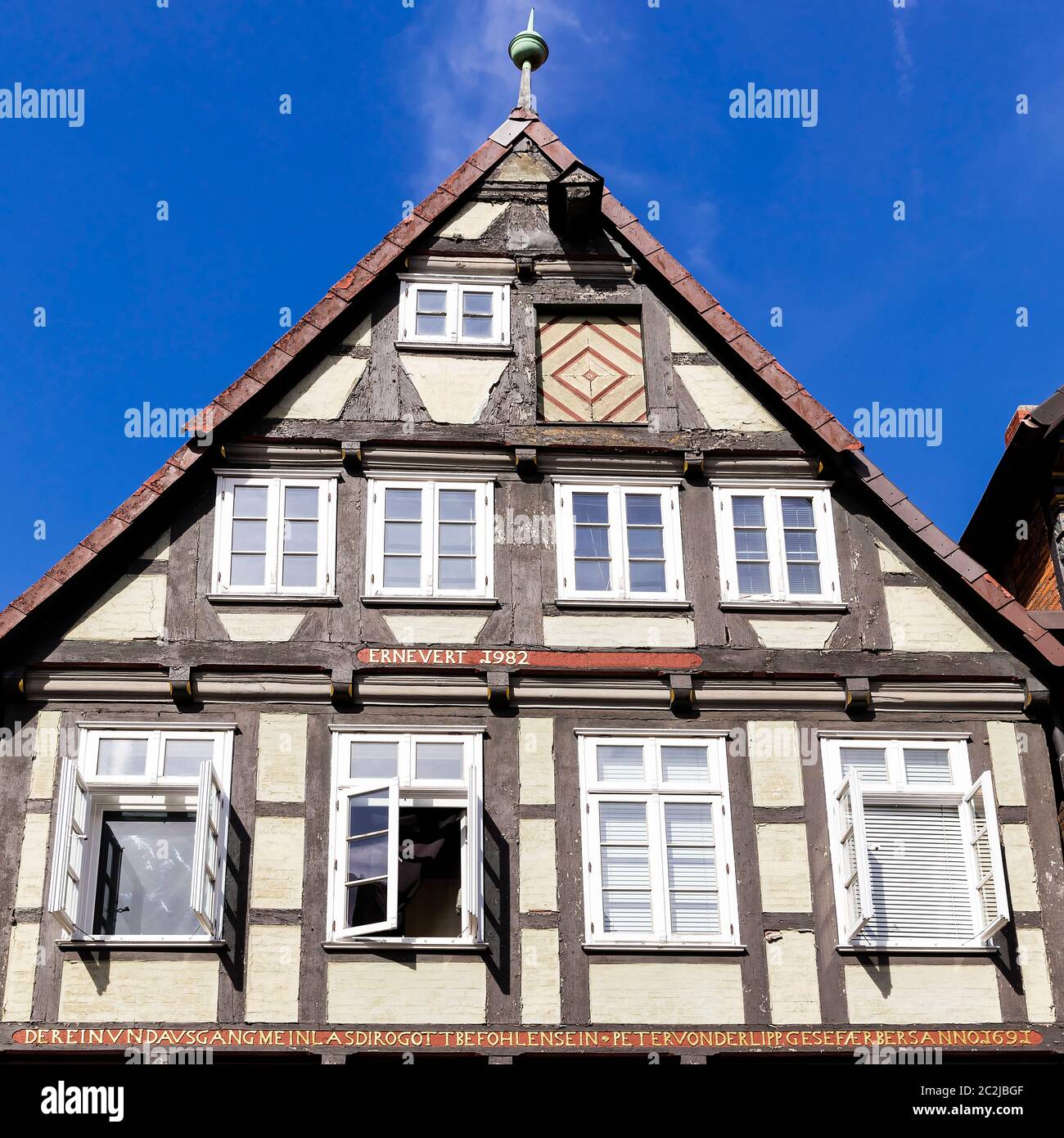 Half-timbered gable with wooden windows of an old half-timbered house ...