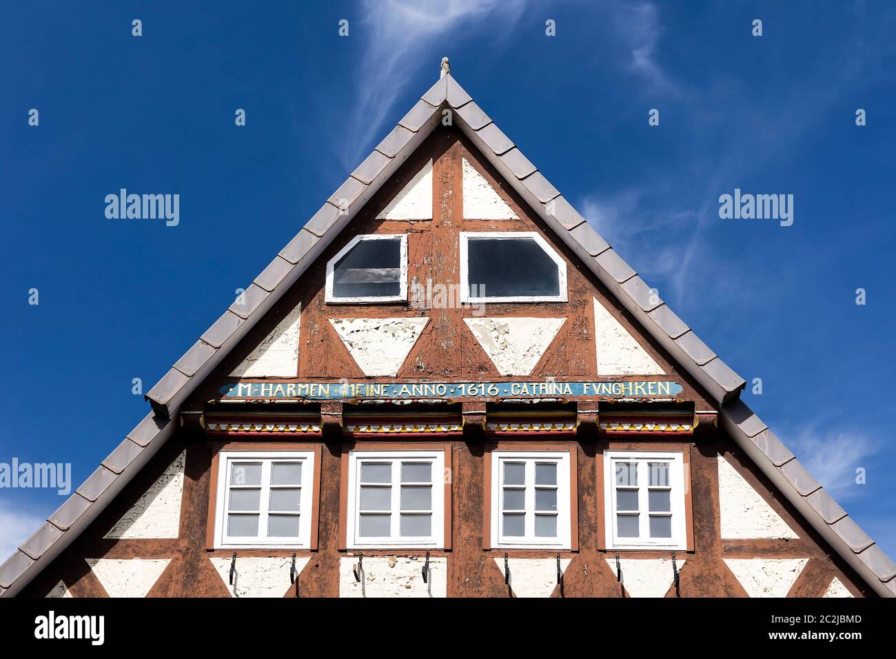 Half-timbered gable with wooden windows of an old half-timbered house ...