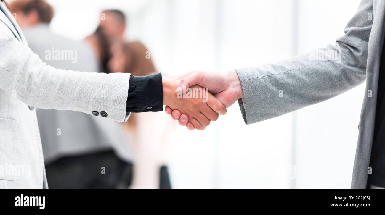 firm business handshake . photo with a copy-space Stock Photo - Alamy