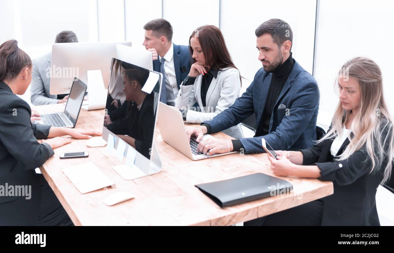 business team works on computers in a modern office Stock Photo - Alamy