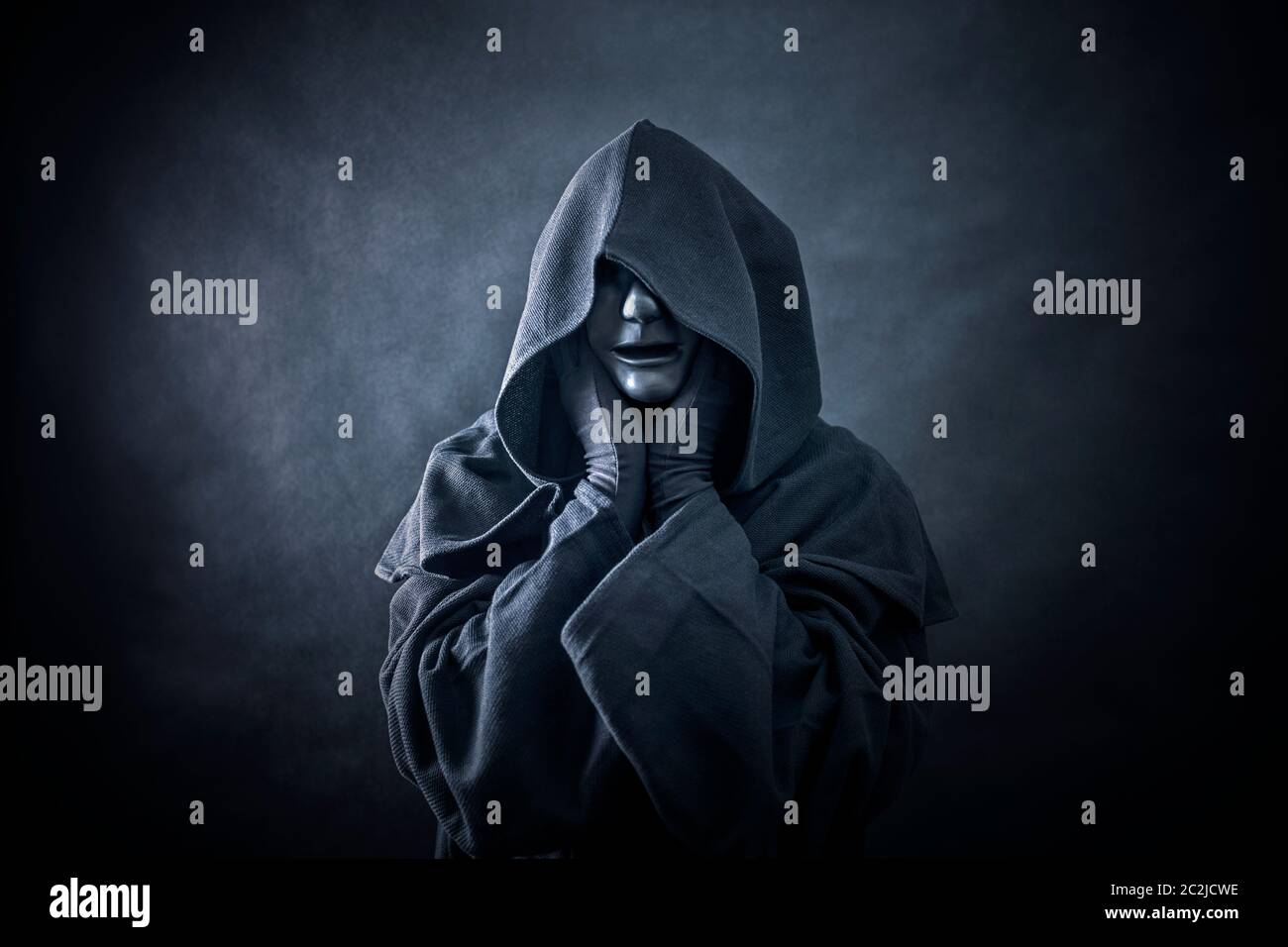 Ghostly figure in hooded cloak. Scary figure with part of mannequin ...