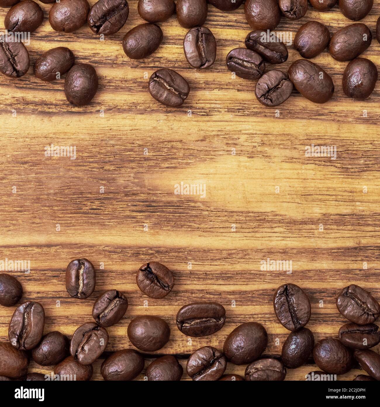 Coffee bean. The background of roasted coffee beans is brown on wooden ...