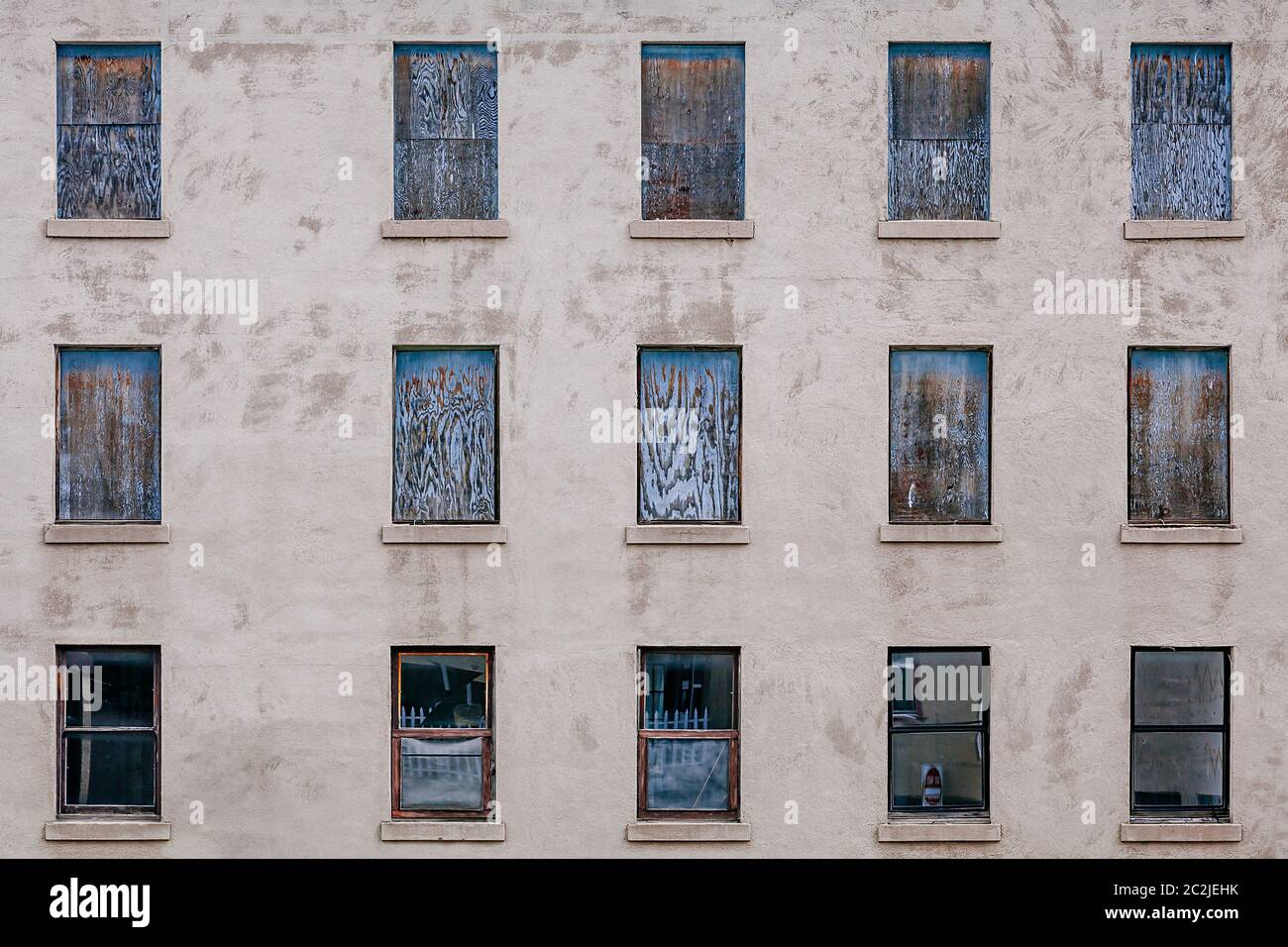 Boarded up windows from an abandoned building in the USA Stock Photo ...