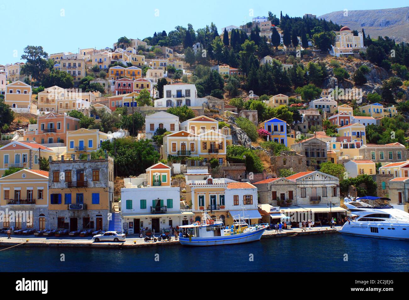Historic Simi island houses and boats in Grece Stock Photo - Alamy