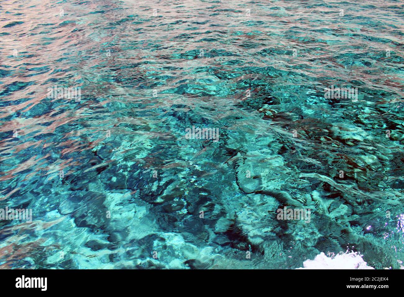 Crystal clear cyan sea water in Greece Stock Photo - Alamy