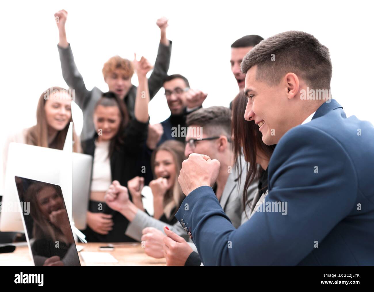 exultant business team looking at the screen of the office computer ...