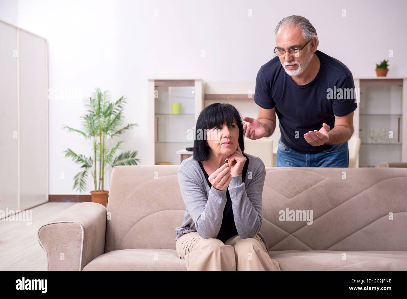 Old couple having argument at the home Stock Photo - Alamy