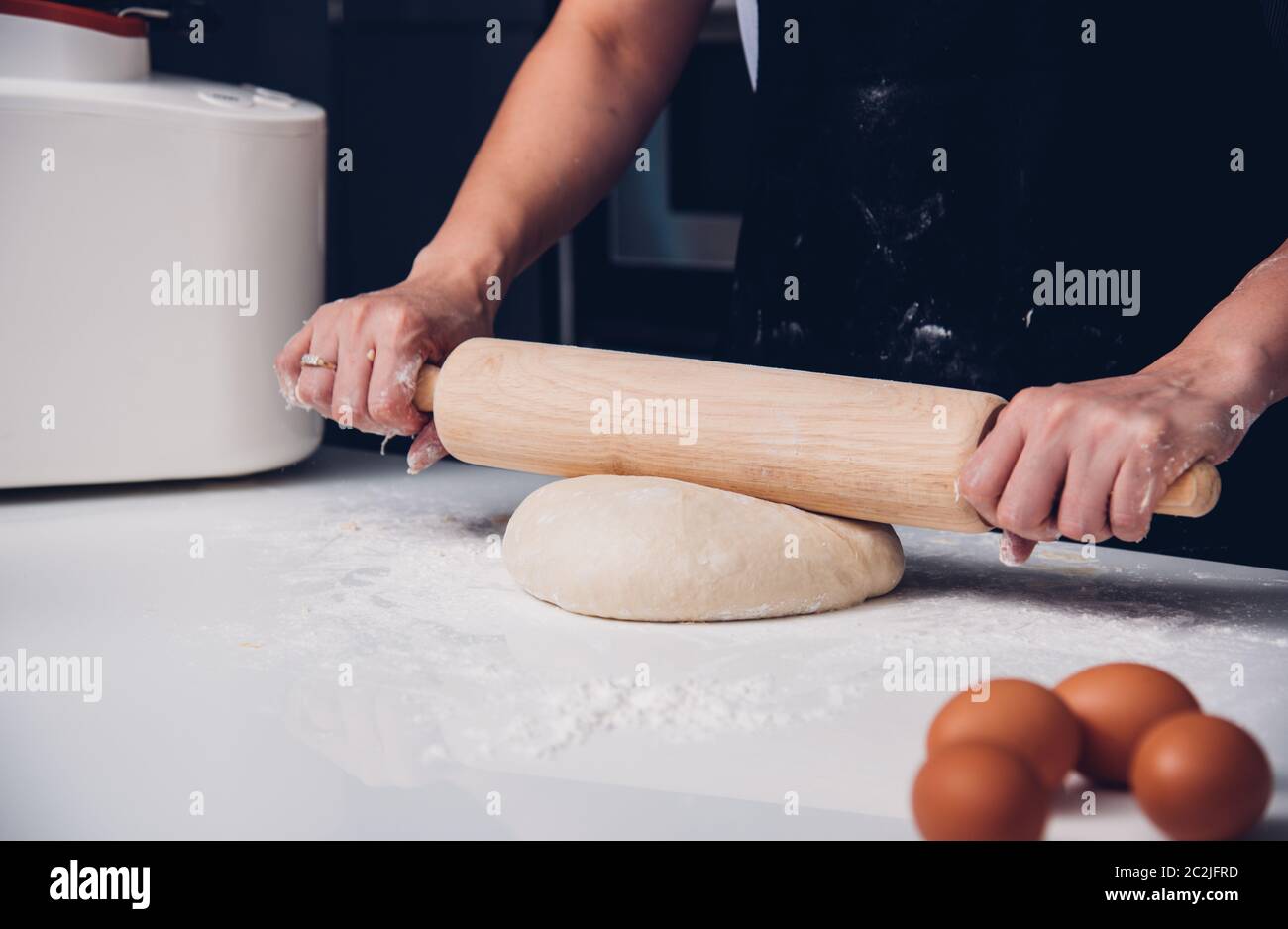 Hand of baker woman female making dough with rolling wooden Stock Photo ...