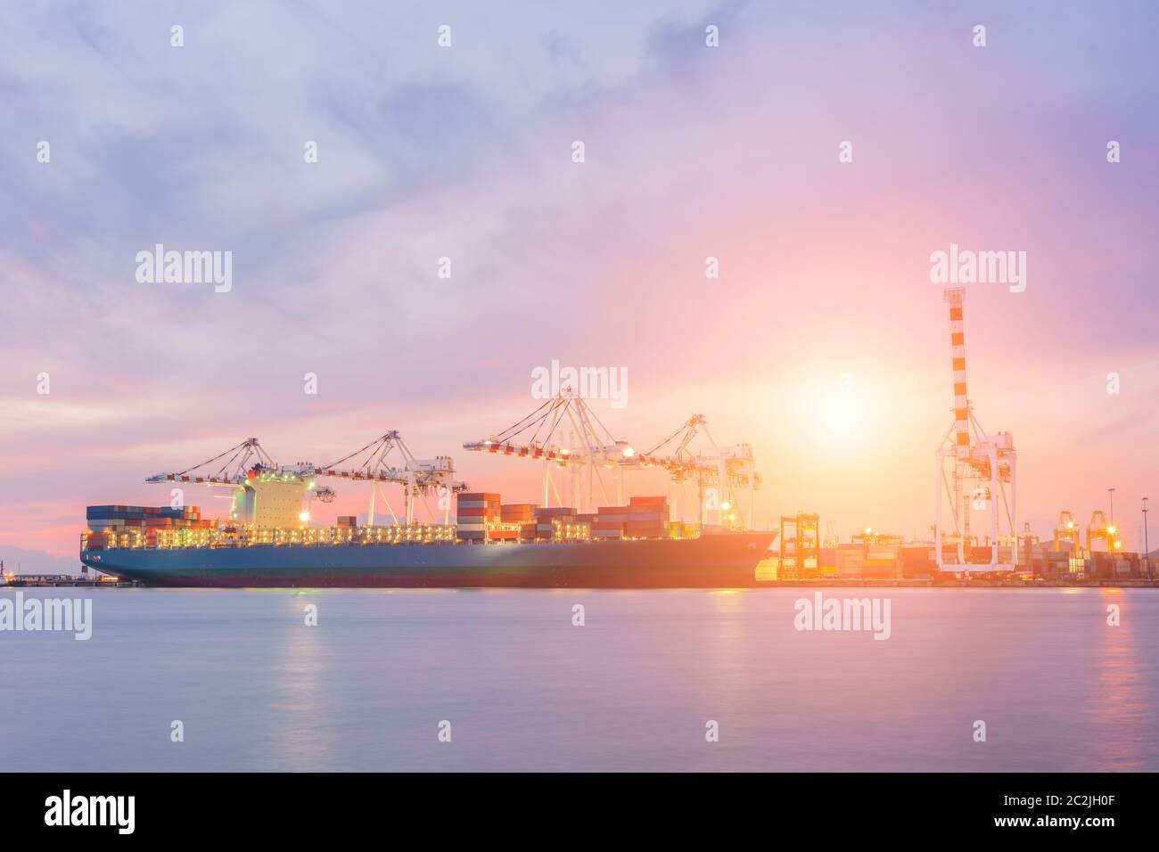 Industrial Container Cargo freight ship with working crane bridge Stock ...