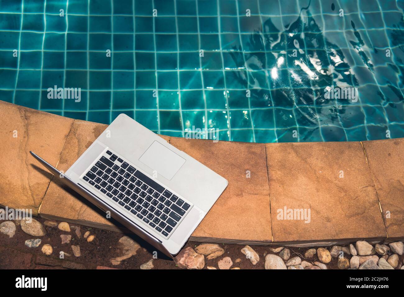 Work notebook laptop computer blank screen near swimming pool Stock ...