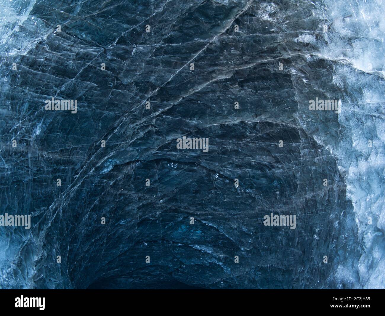 The light-flooded ice inside a glacier in island Stock Photo - Alamy