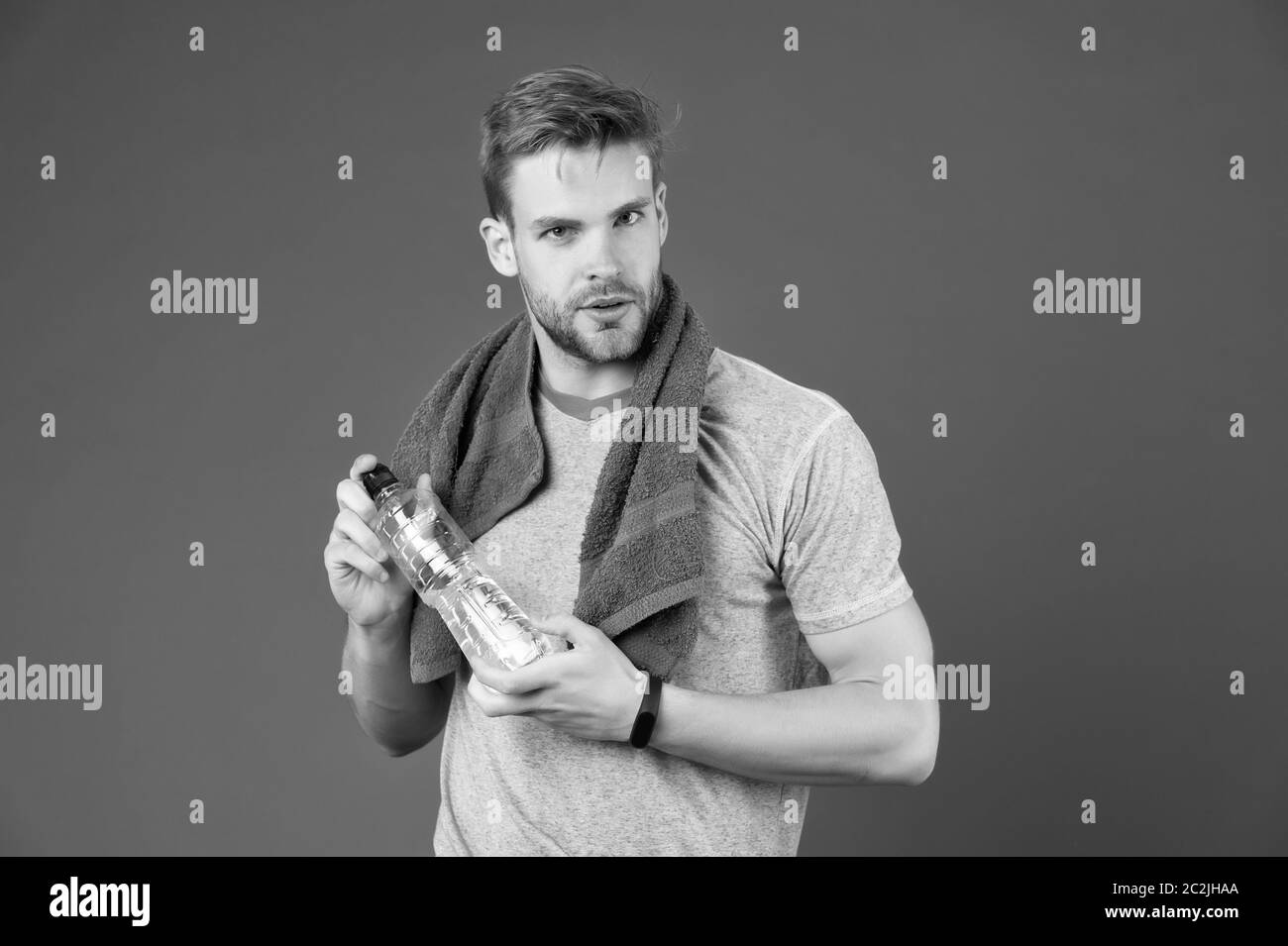 Body hydration. Refreshing vitamin drink after great workout. Man ...