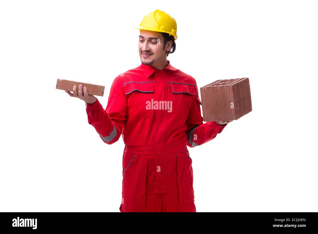 Young male mason with brick isolated on the white Stock Photo - Alamy