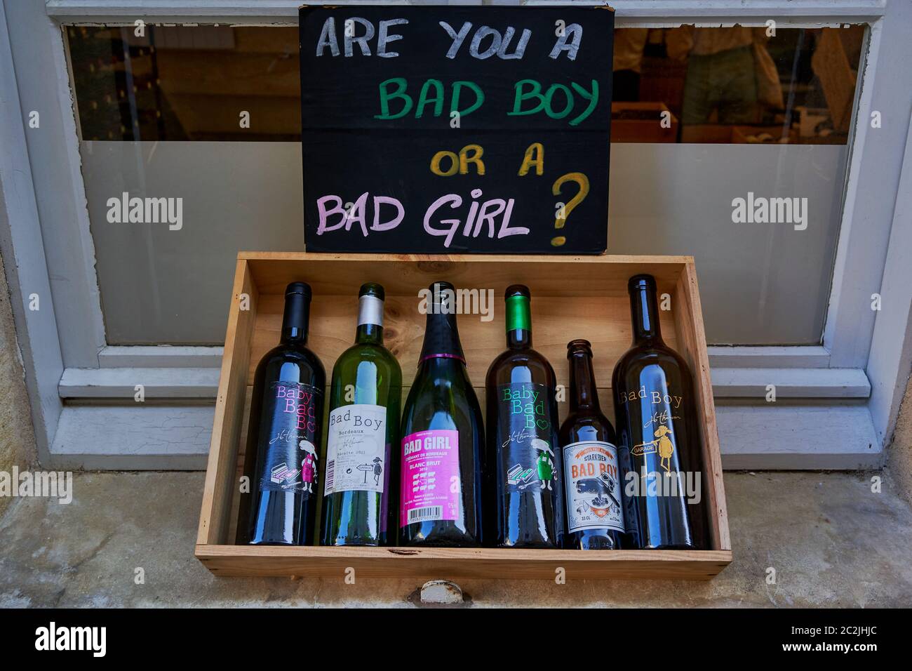 "Are you a bad boy or a bad girl?" sign on a crate of wine branded bad ...