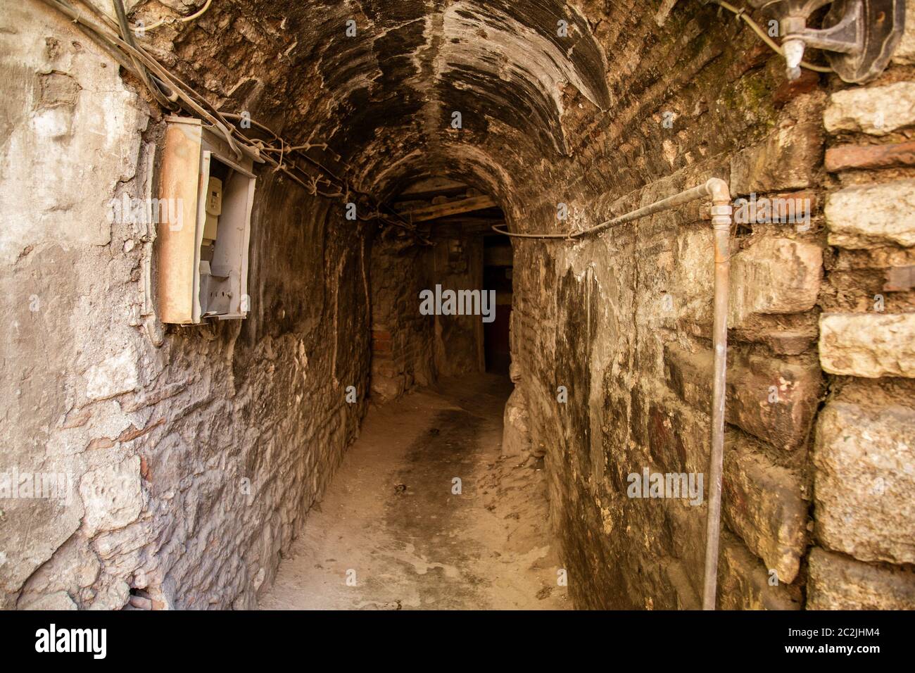 Old abandoned tunnel in the slum underground cellar. Entrance to urban ...