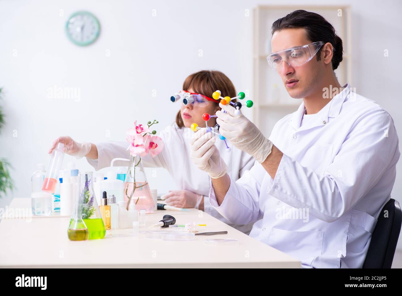 The two chemists working in the lab Stock Photo - Alamy