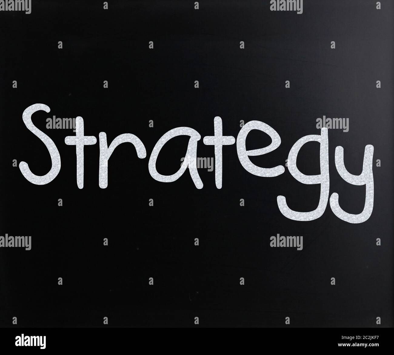 "Strategy" handwritten with white chalk on a blackboard Stock Photo - Alamy