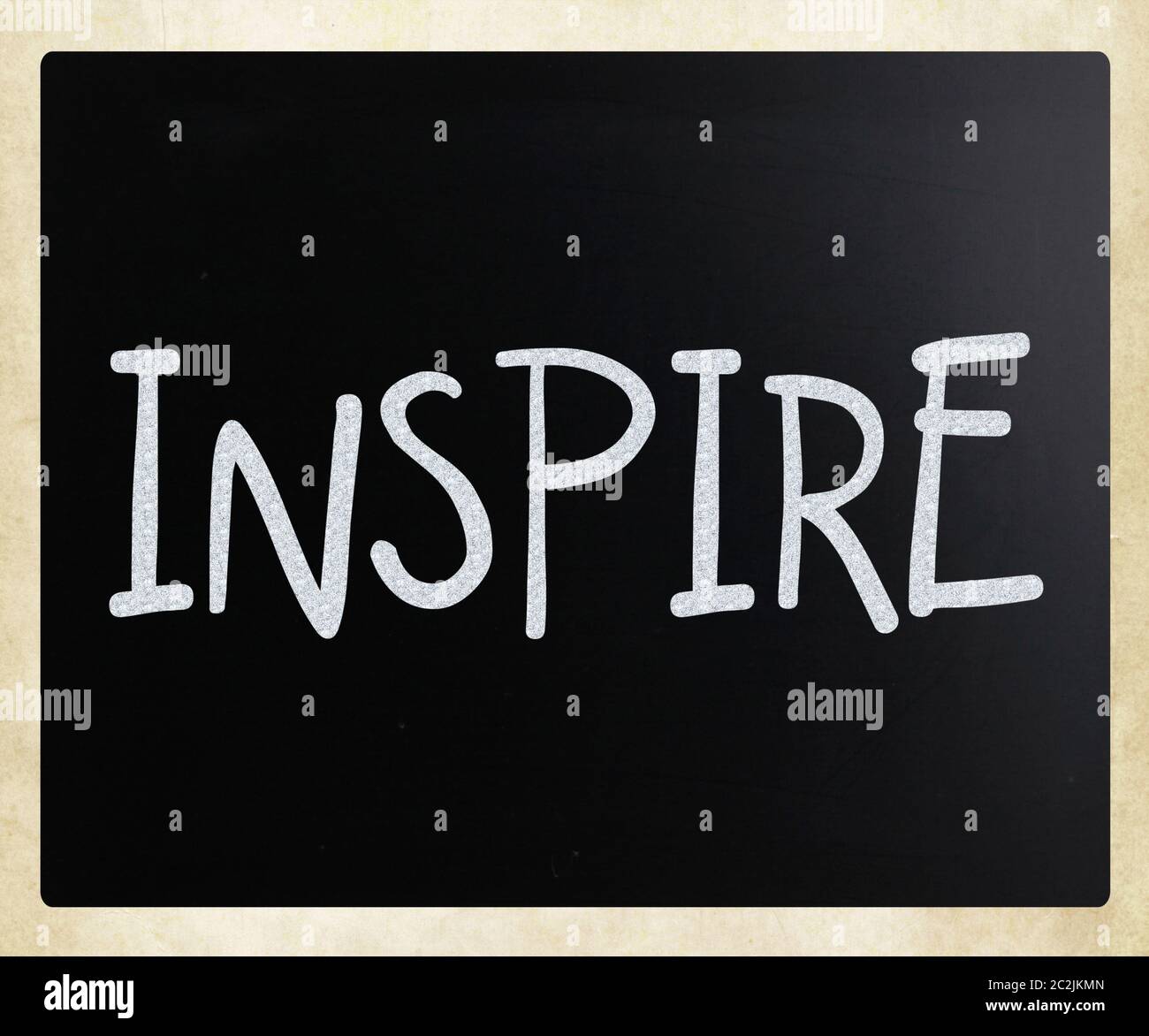 "Inspire" handwritten with white chalk on a blackboard Stock Photo - Alamy