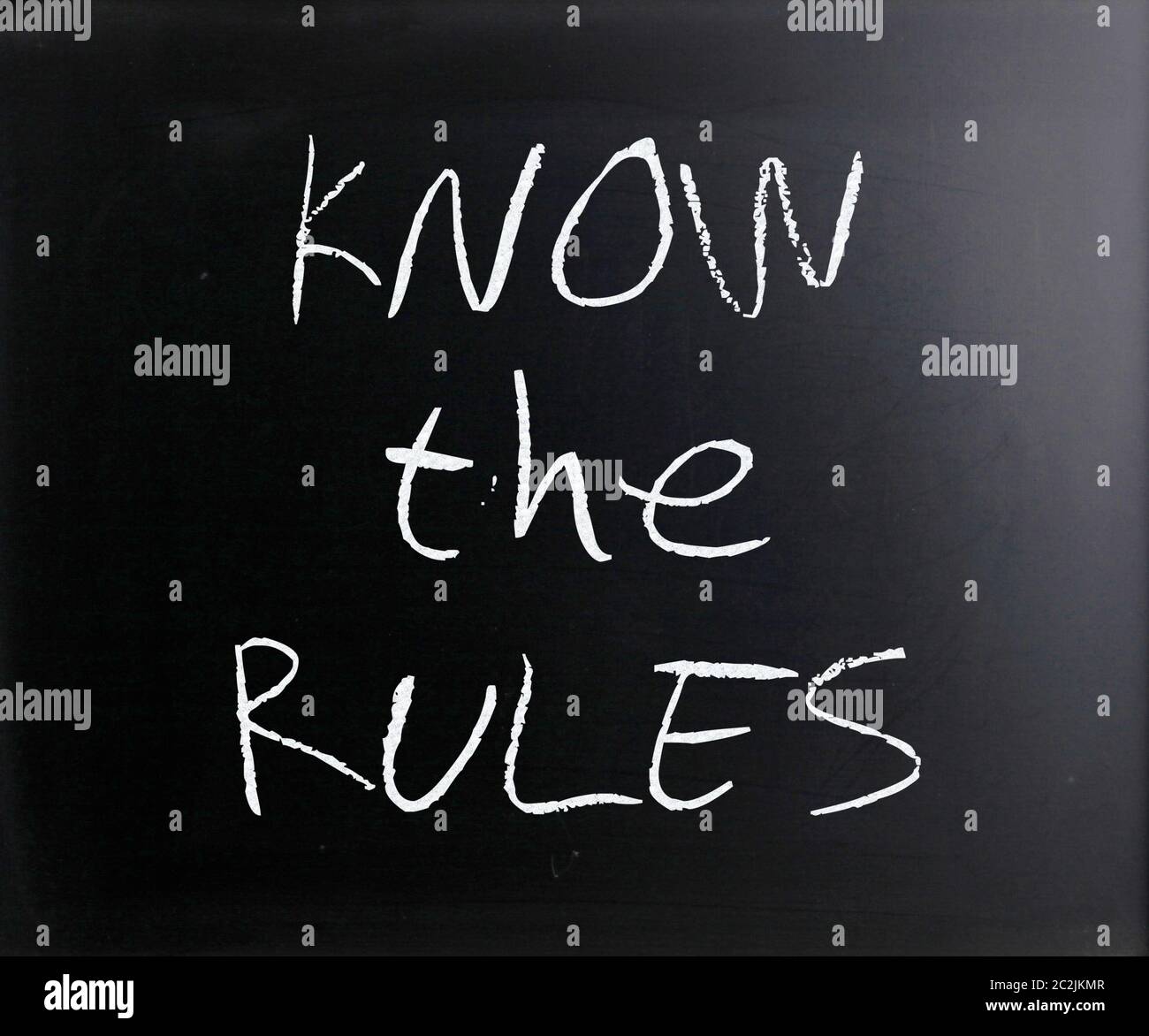 "Know the rules" handwritten with white chalk on a blackboard Stock ...