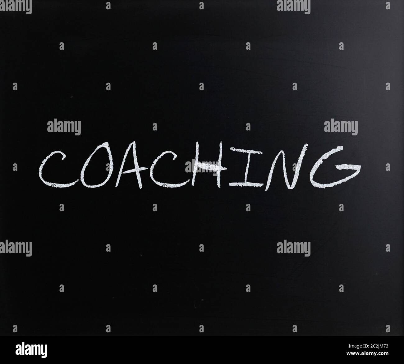 "Coaching" handwritten with white chalk on a blackboard Stock Photo - Alamy