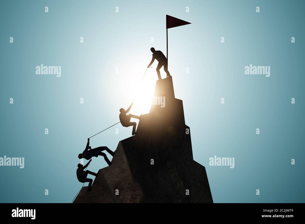 Concept of teamwork with team climbing mountain Stock Photo - Alamy
