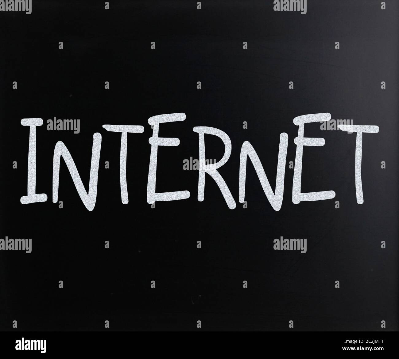 The word "Internet" handwritten with white chalk on a blackboard Stock ...