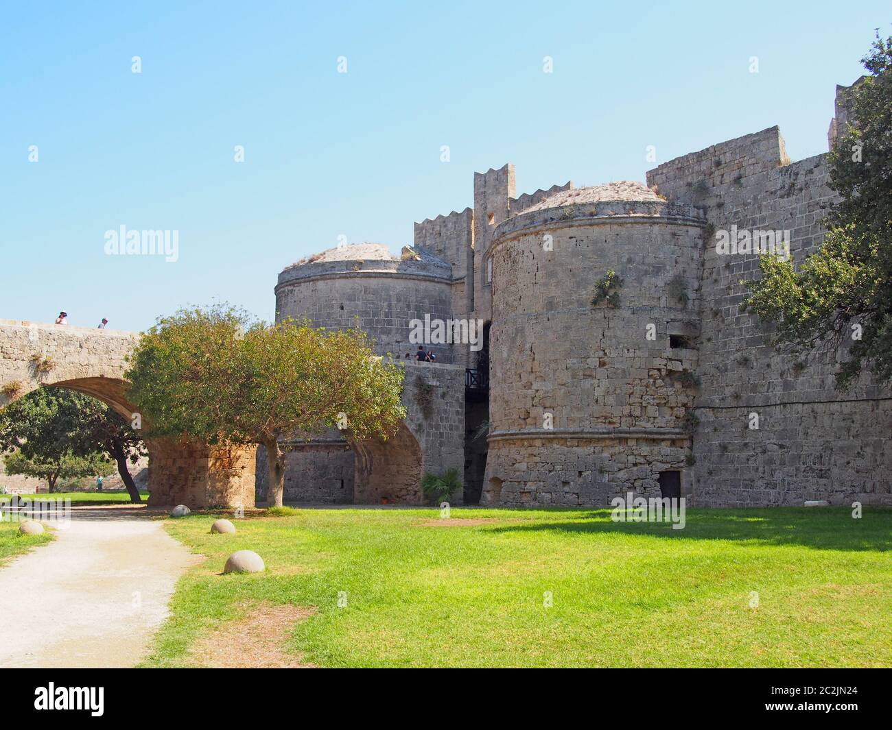 people crossing the amboise gate in the medieval walls of the old city ...