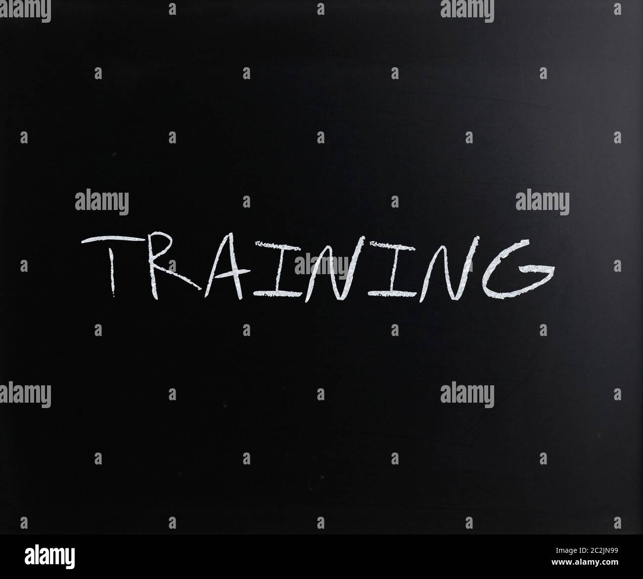 "Training" handwritten with white chalk on a blackboard Stock Photo - Alamy