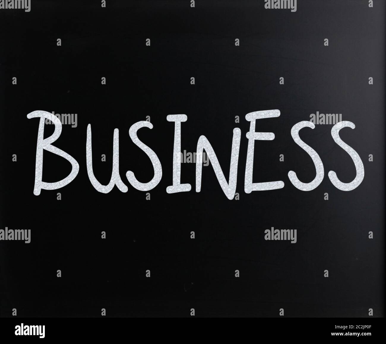 The word "Business" handwritten with white chalk on a blackboard Stock ...