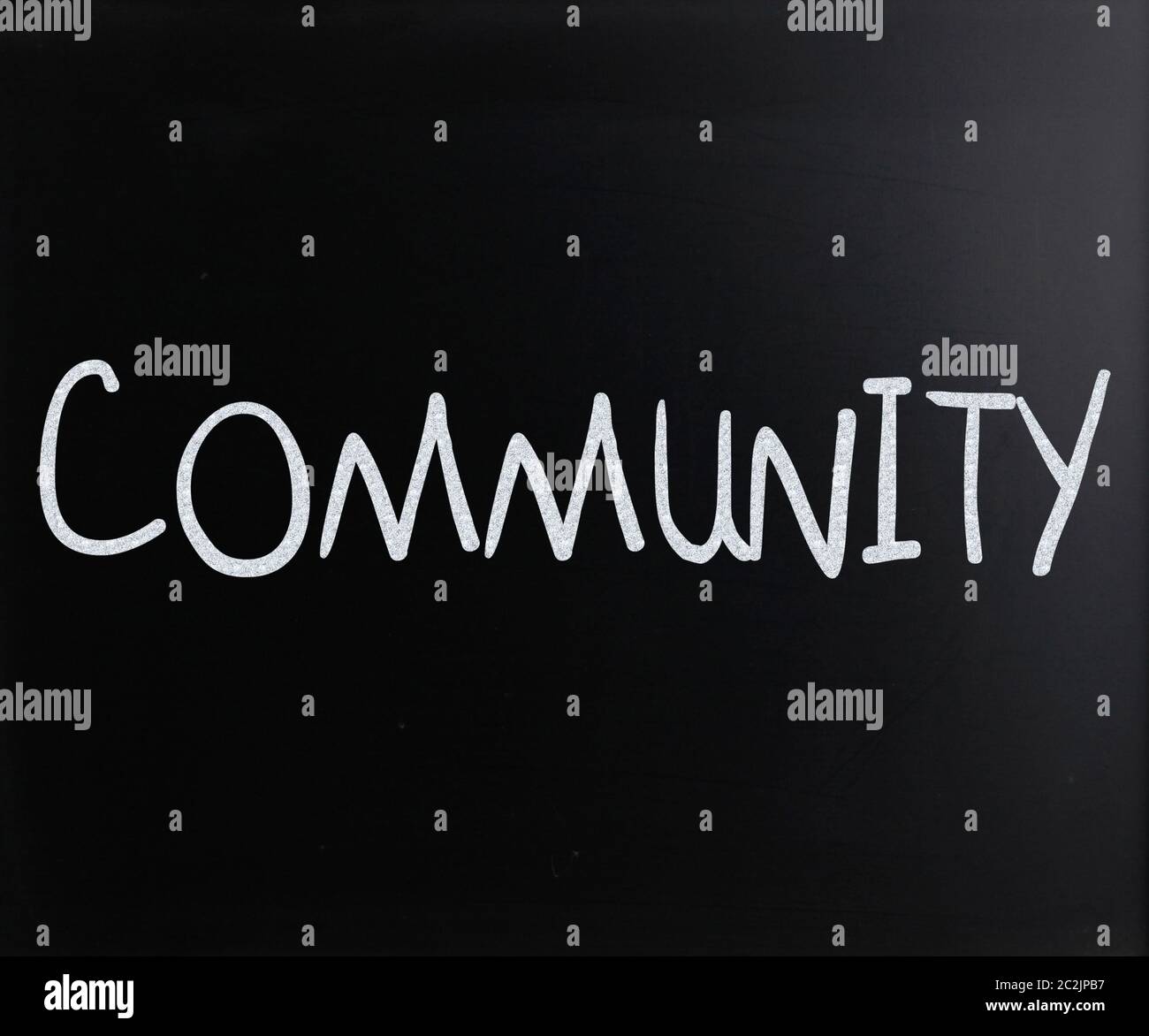 "Community" handwritten with white chalk on a blackboard Stock Photo ...