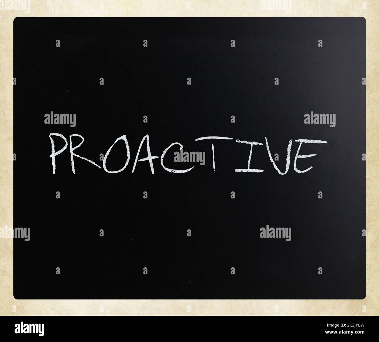 The word 'Proactive' handwritten with white chalk on a blackboard Stock ...